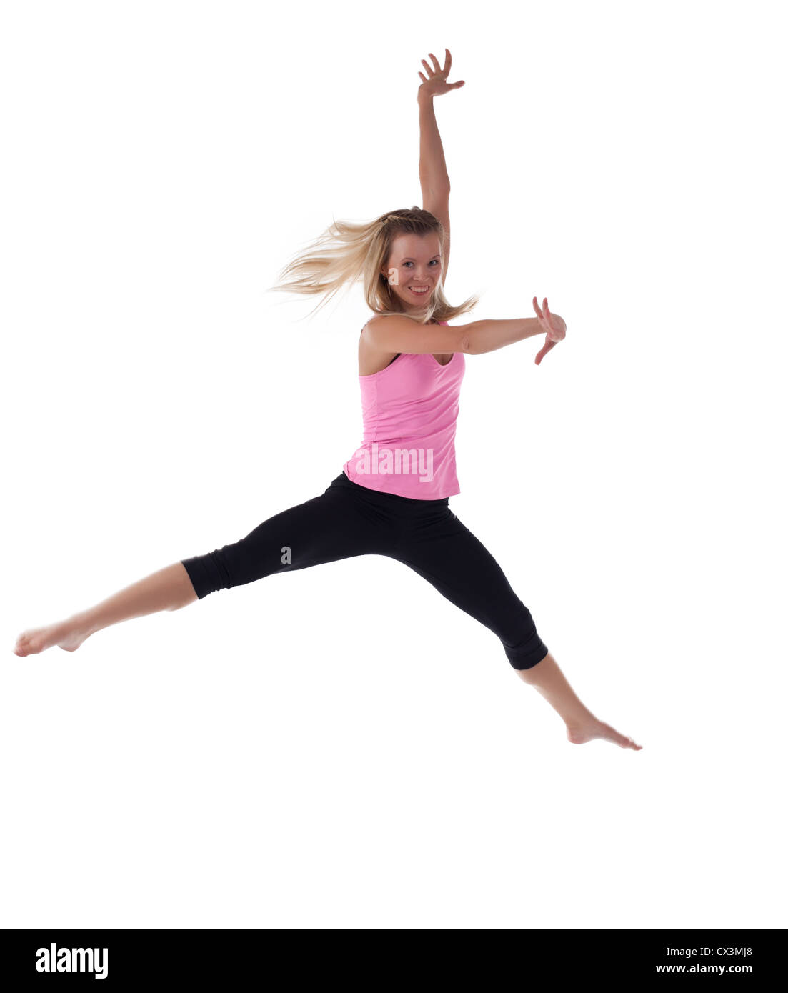 Blond woman doing jump in fitness cloth isolated Stock Photo - Alamy