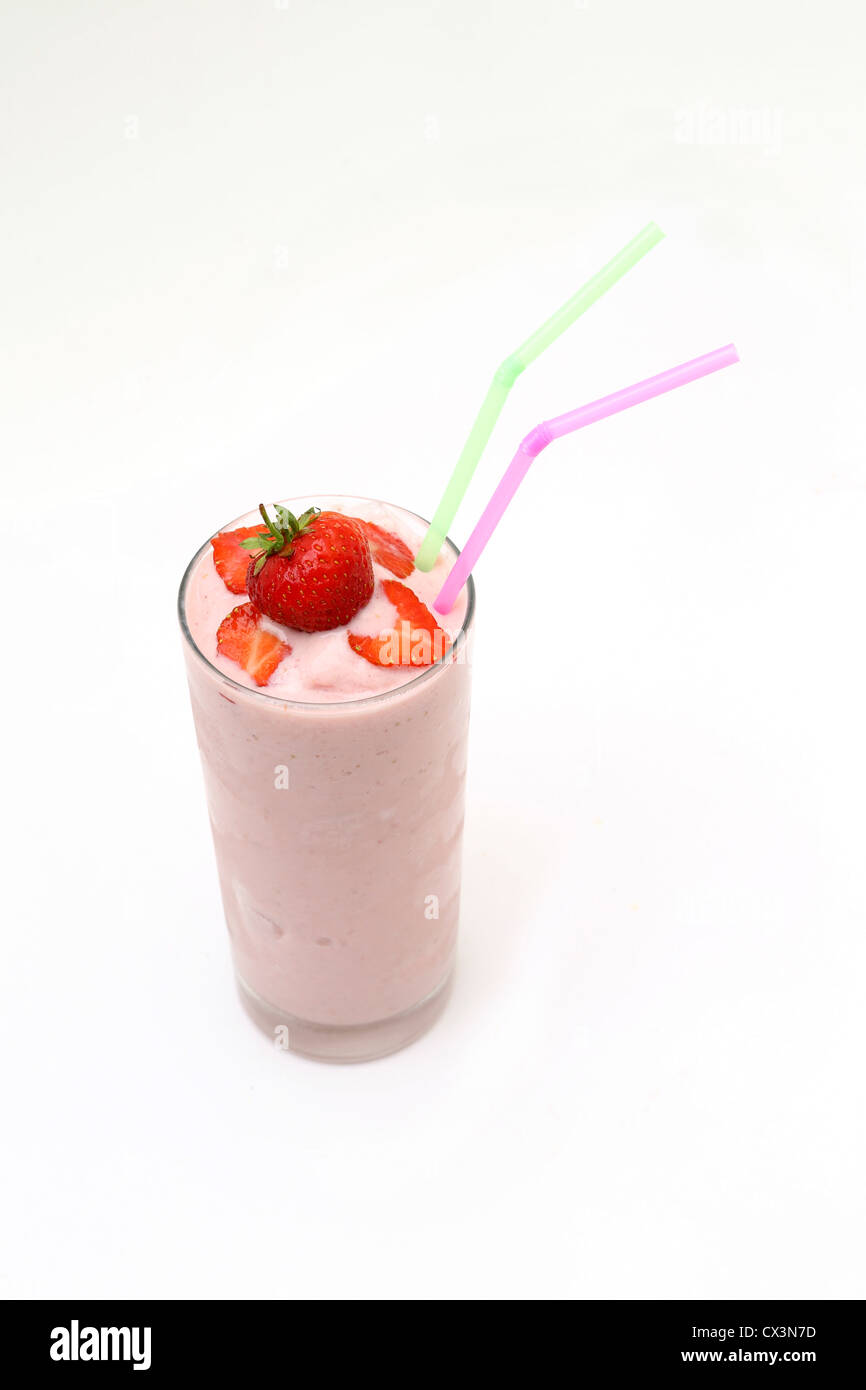 Strawberry Milkshake In A Glass With Strawberries And Two Straws Stock ...