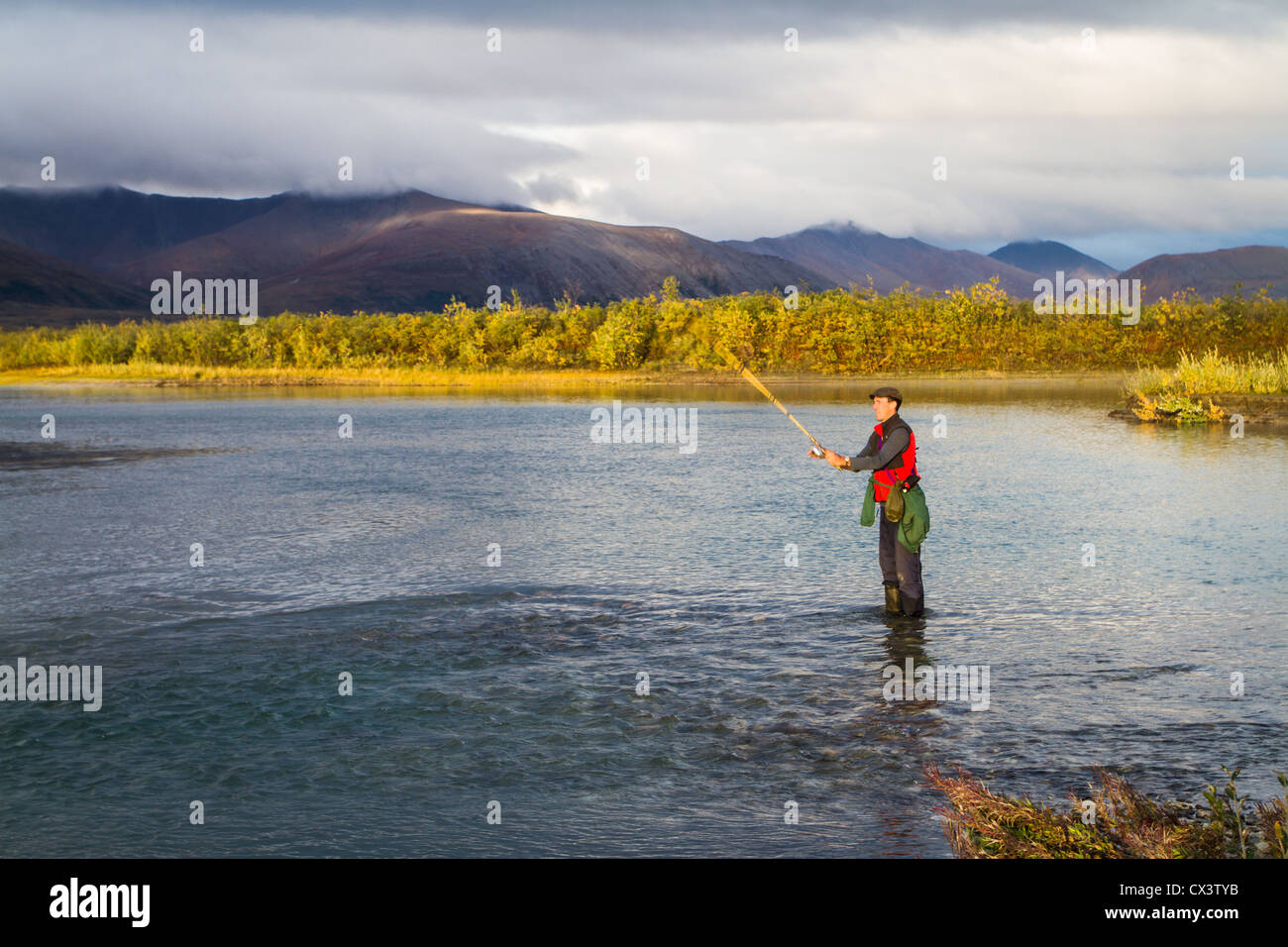 A man fishes in the Noatak River in Noatak National Preserve, Alaska ...