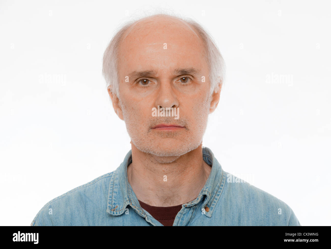 A portrait of a balding middle aged man in front of a white background ...