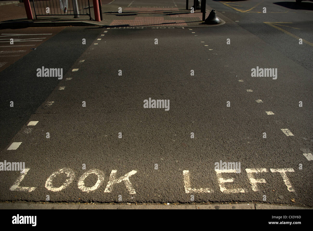 Look Left painted instruction for a pedestrian crossing Stock Photo - Alamy