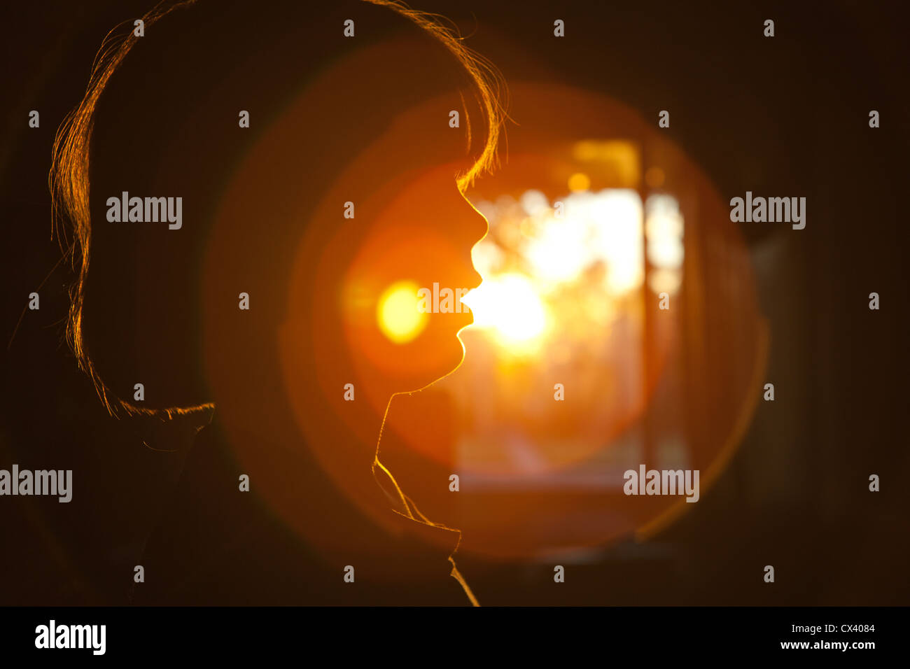 Profile of ten year old boy and solar flare around his face Stock Photo ...