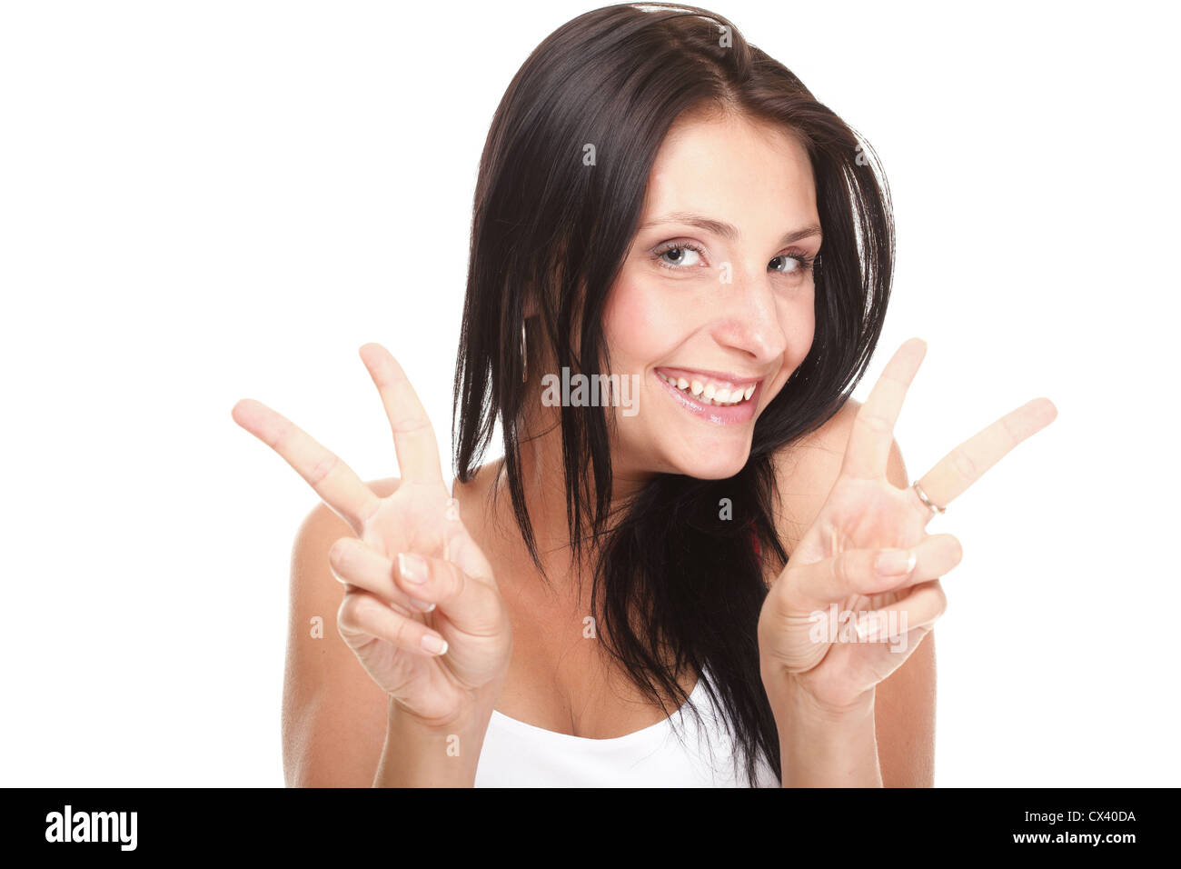 Portrait of a pretty young woman showing the peace sign Stock Photo - Alamy