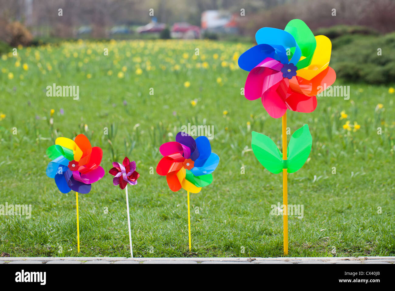 Pinwheel on green grass in summer day Stock Photo - Alamy