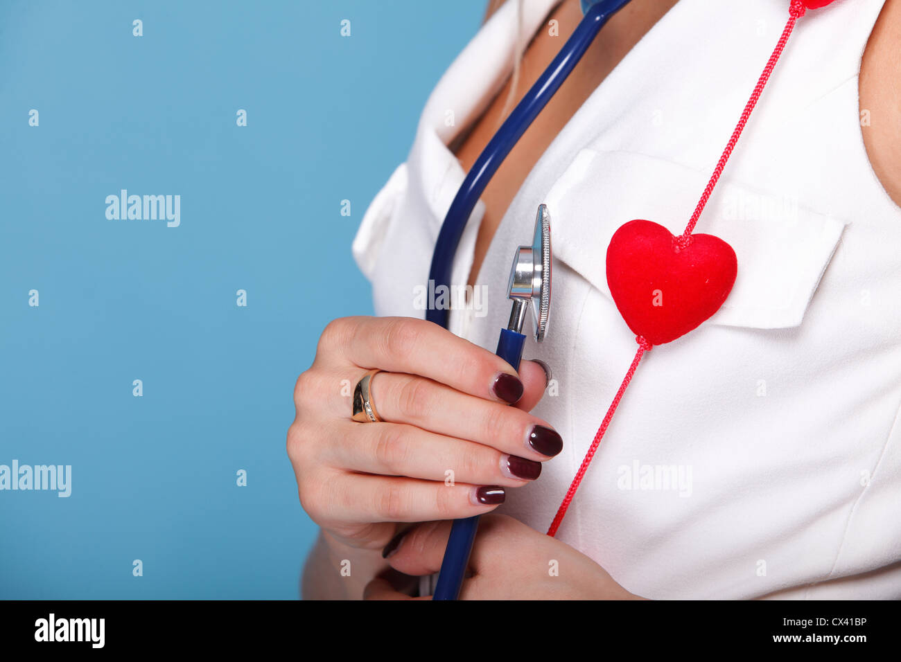 red heart woman in nurse suit with stethoscope blue background Stock ...