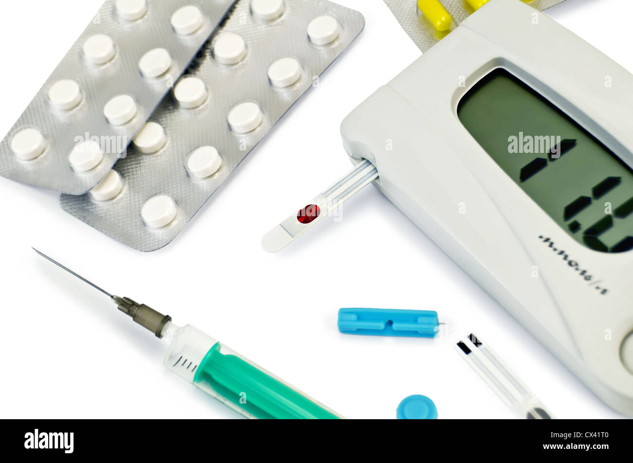 Grey instrument for measuring blood sugar with test strip, tablets and ...
