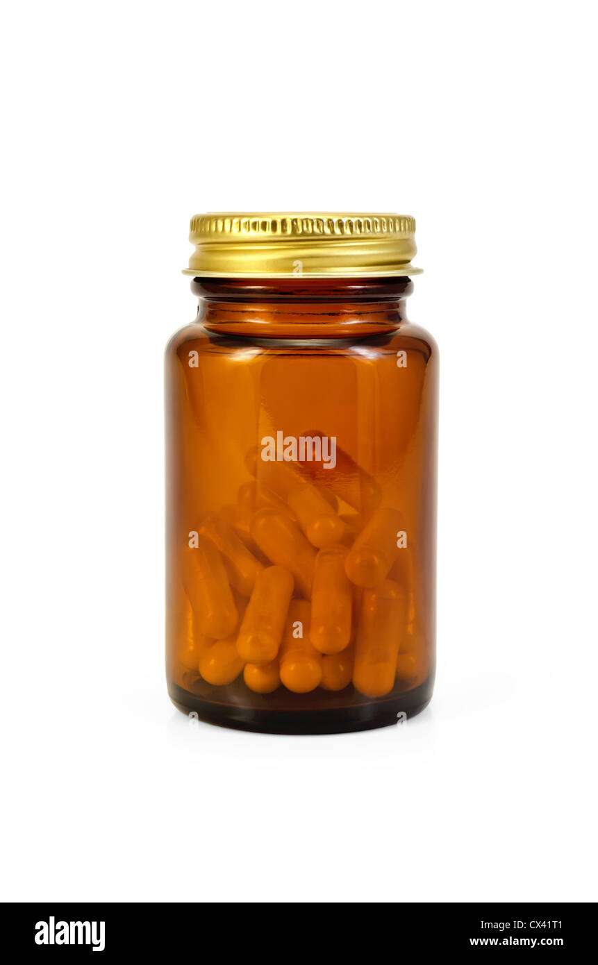 Capsules in a brown jar isolated on white background Stock Photo - Alamy