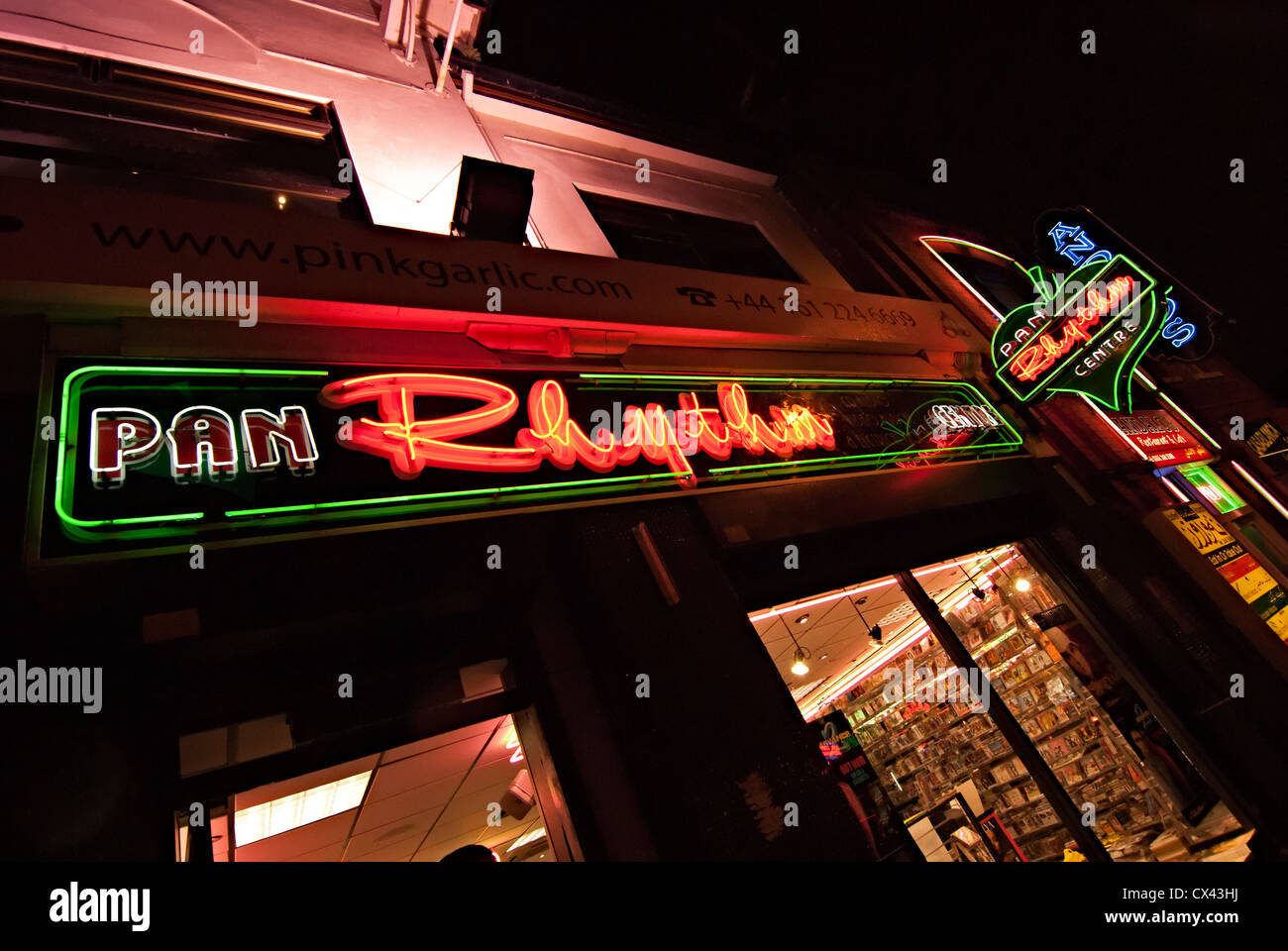 Manchester curry mile rusholme wimslow road with neon shop signs Stock ...