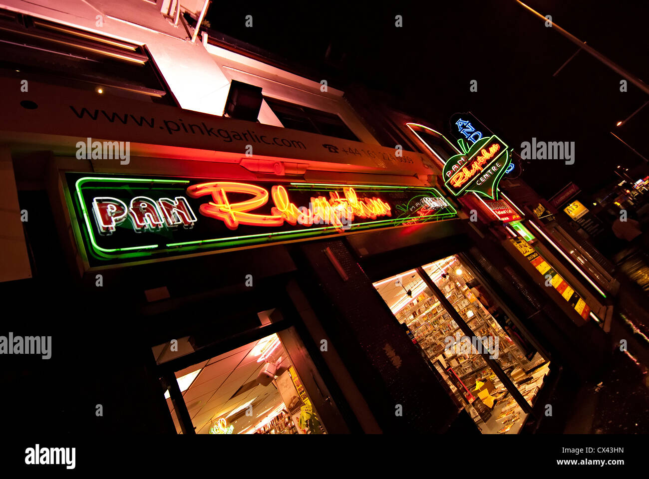 Manchester curry mile rusholme wimslow road with neon shop signs pan ...