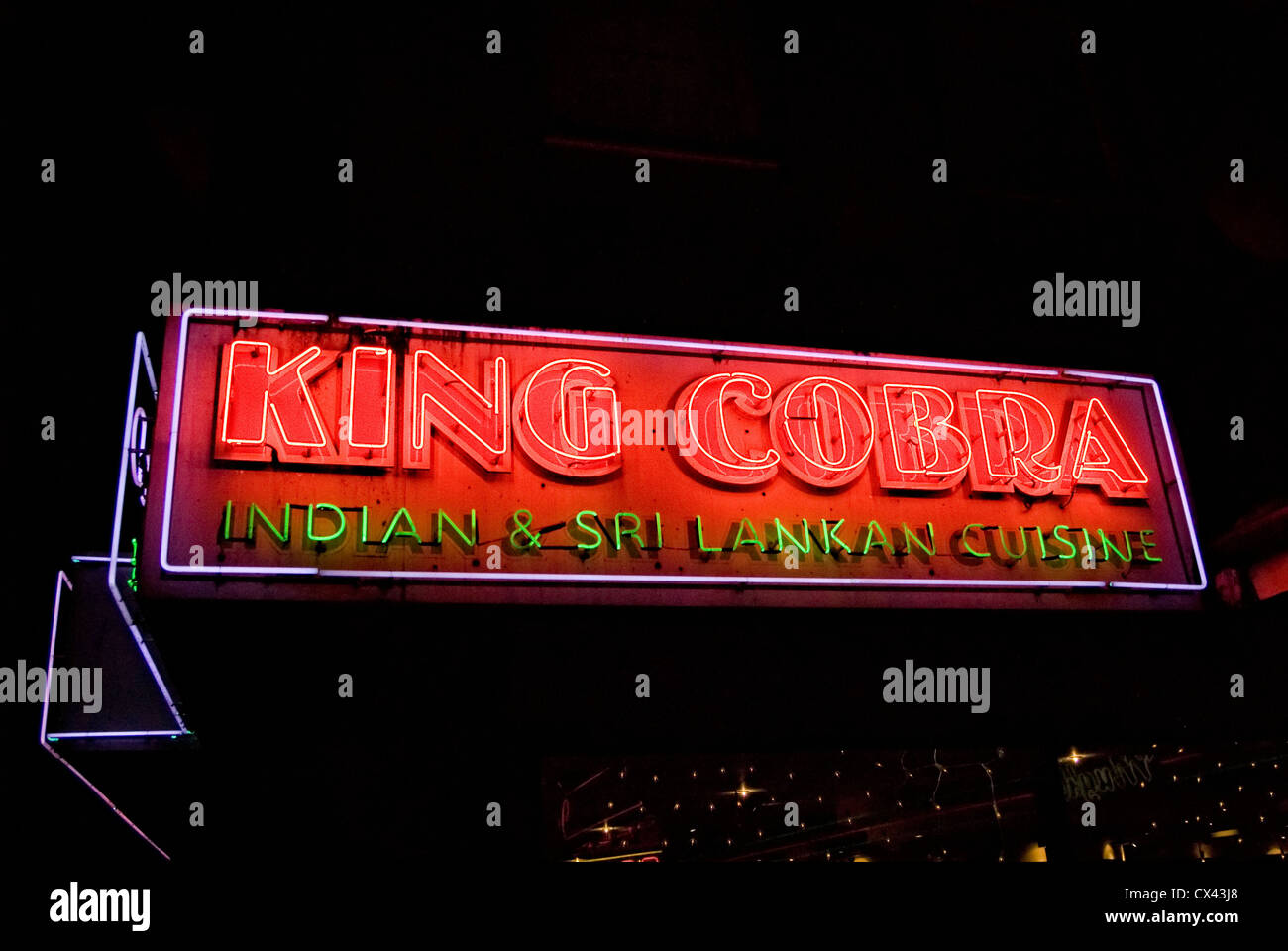 Manchester curry mile rusholme wimslow road with neon shop signs king ...
