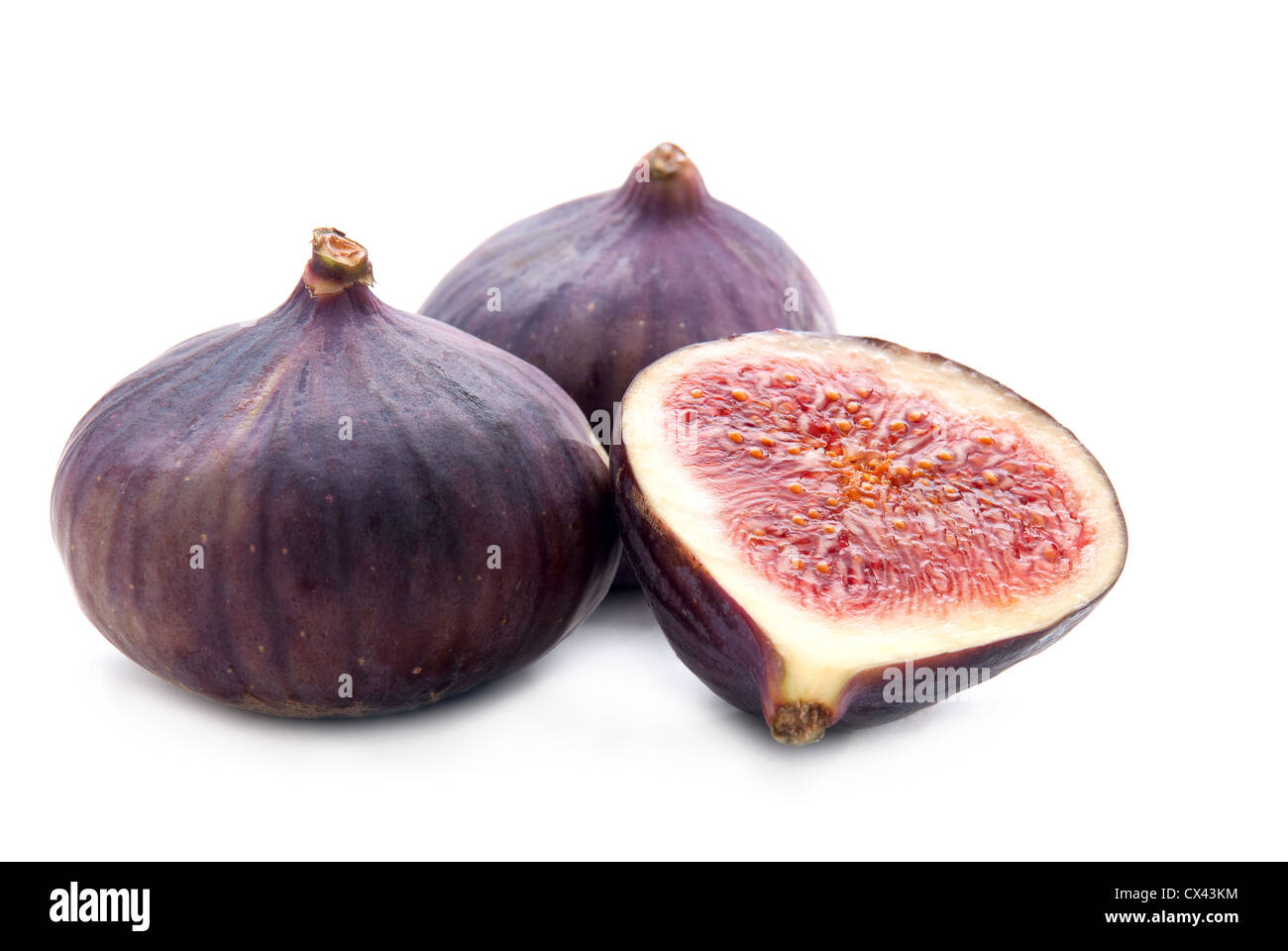 Two Figs and Slice Isolation on White Background Stock Photo - Alamy