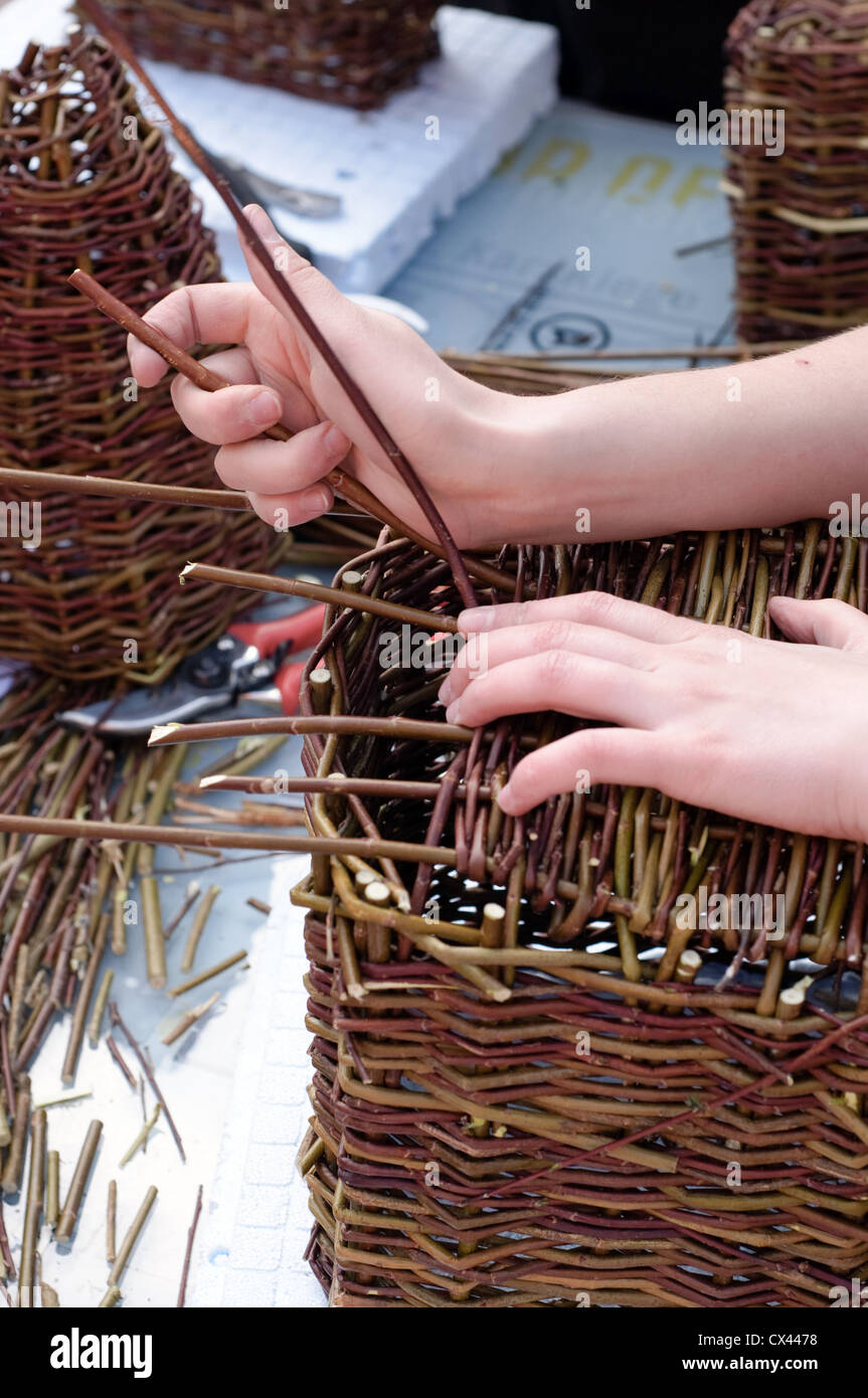 Photo of woman making basket out of wicker Stock Photo - Alamy
