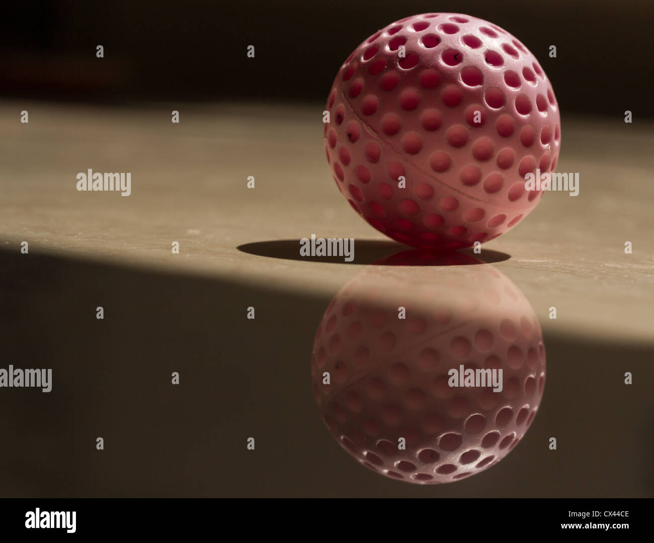 Golf ball with shadow and reflection Stock Photo - Alamy