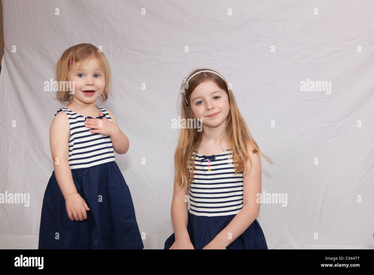 two happy girls - sisters Stock Photo - Alamy
