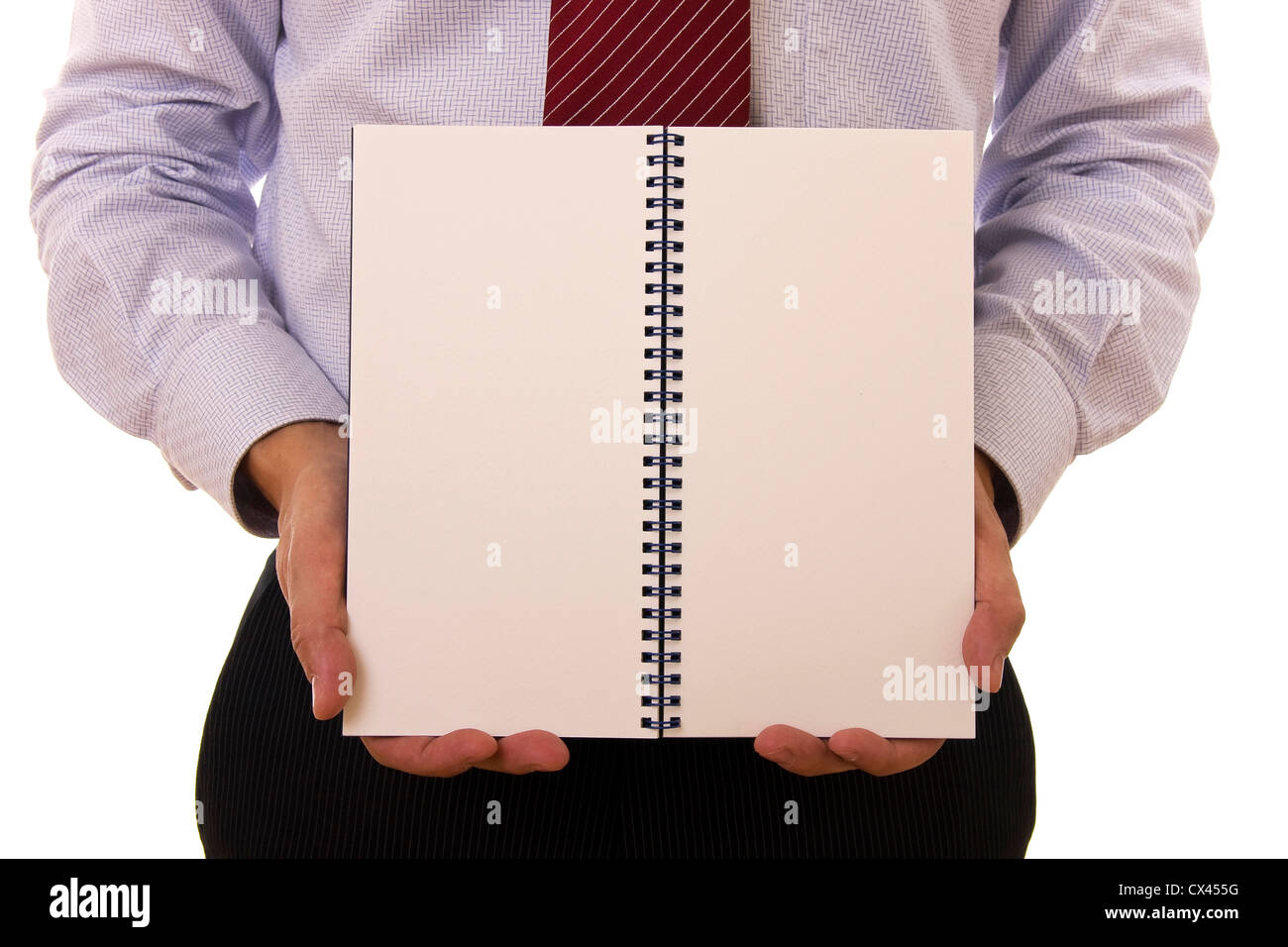 Business man holding a empty spiral note-book Stock Photo - Alamy