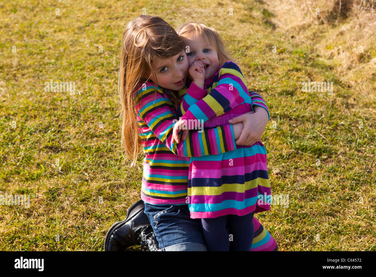 two happy girls - sisters Stock Photo - Alamy