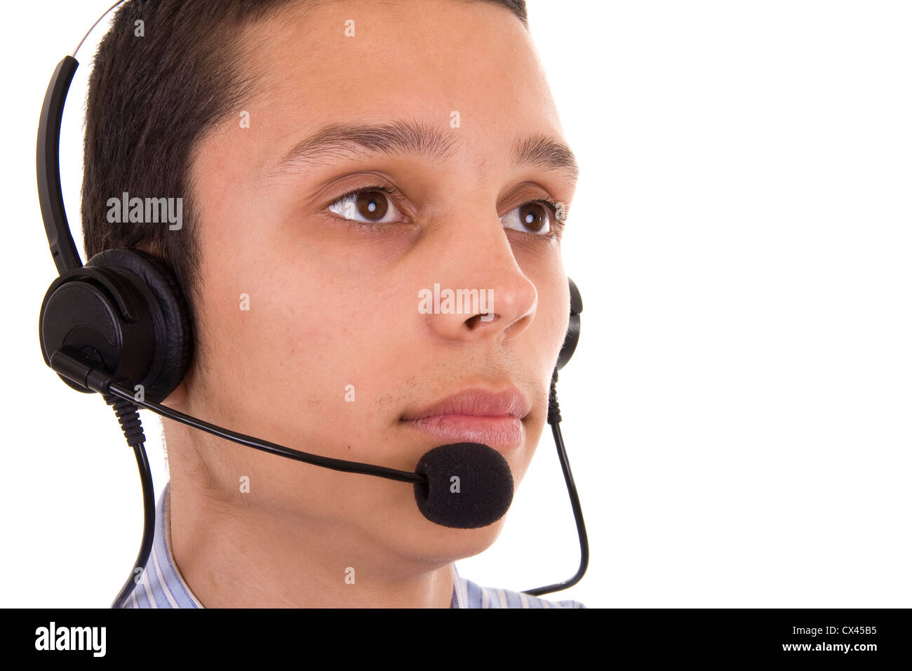 Serious young man with telephone headset Stock Photo - Alamy