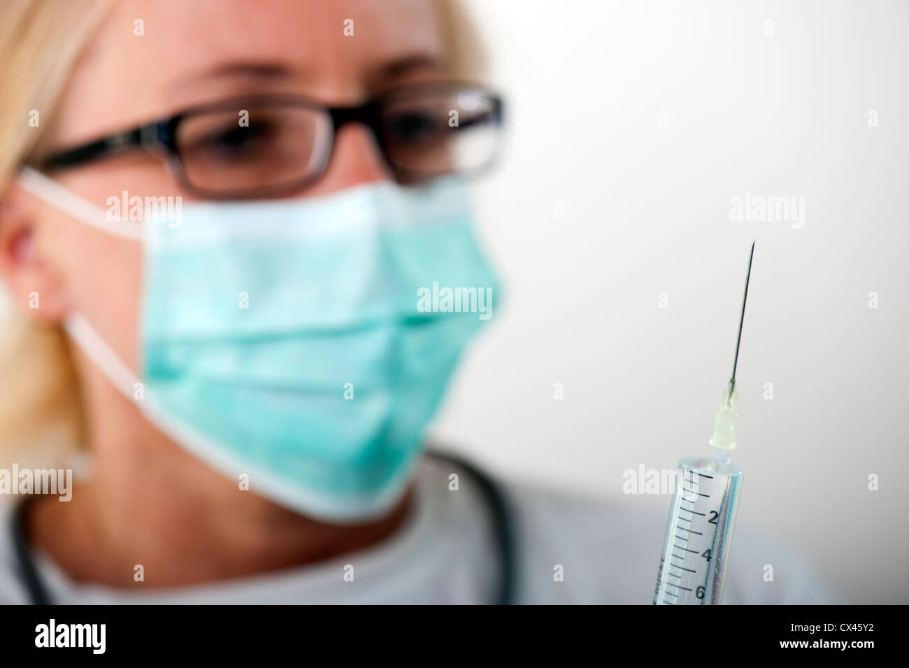 Female doctor testing injection Stock Photo - Alamy