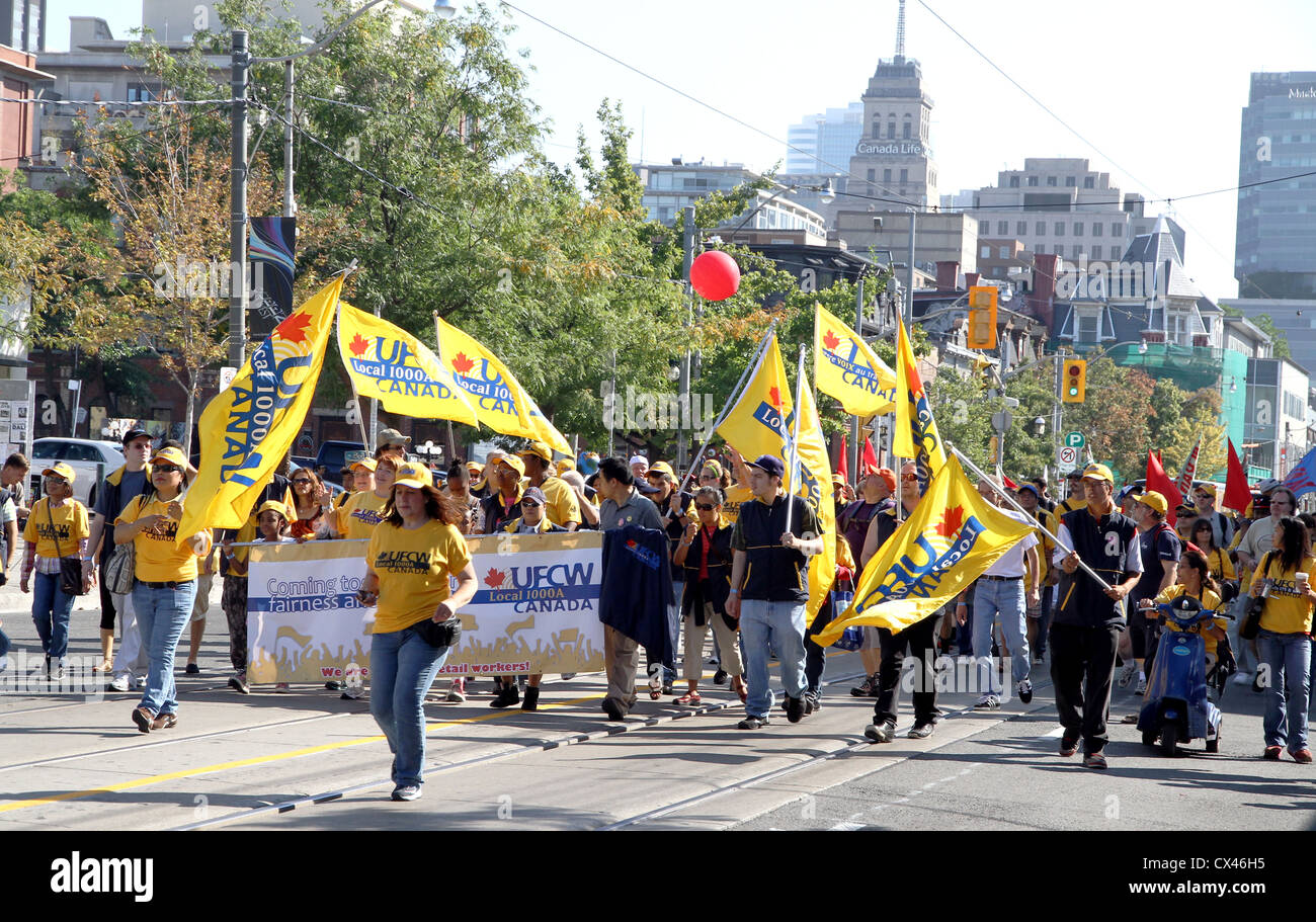 People marching in the streets of Toronto during the annual Labor Day ...