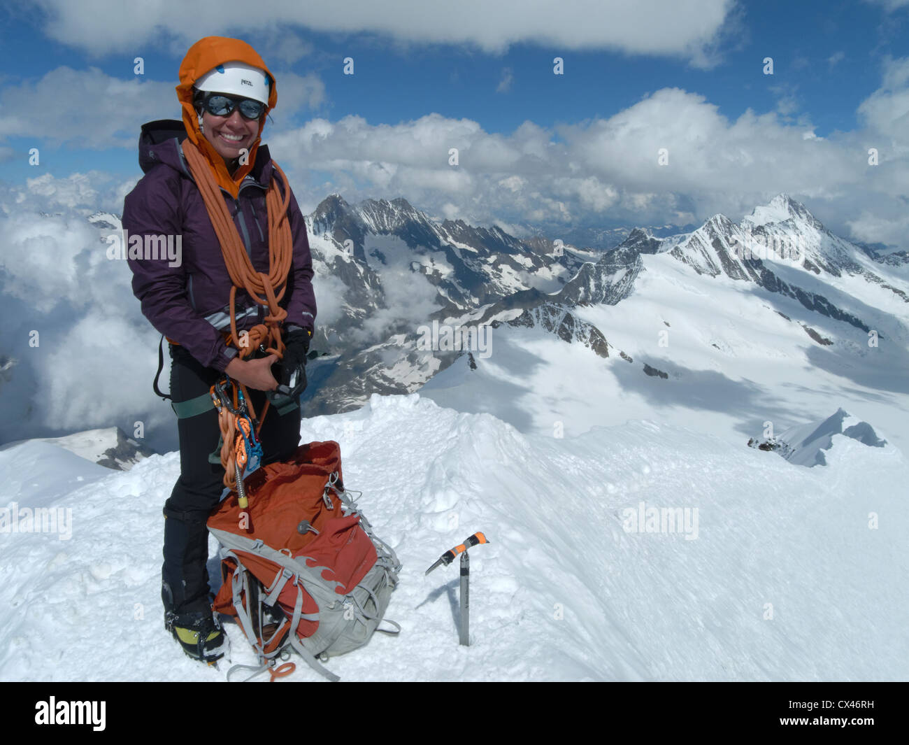An alpine climber on the top of the Monch Switzerland Stock Photo - Alamy