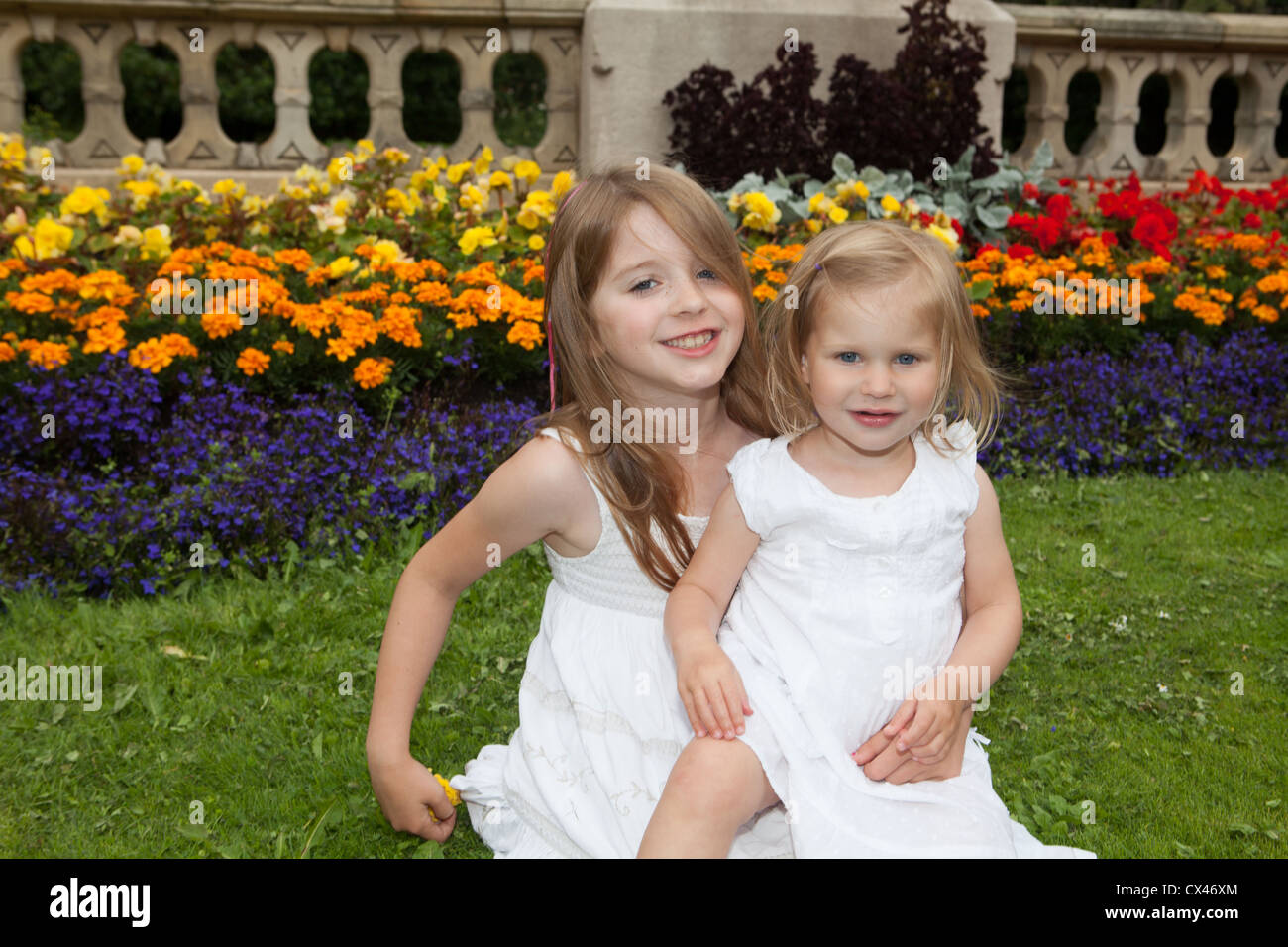 two happy girls - sisters Stock Photo - Alamy