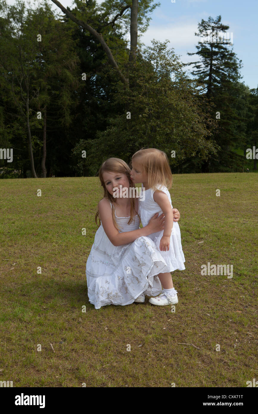 two happy girls - sisters Stock Photo - Alamy
