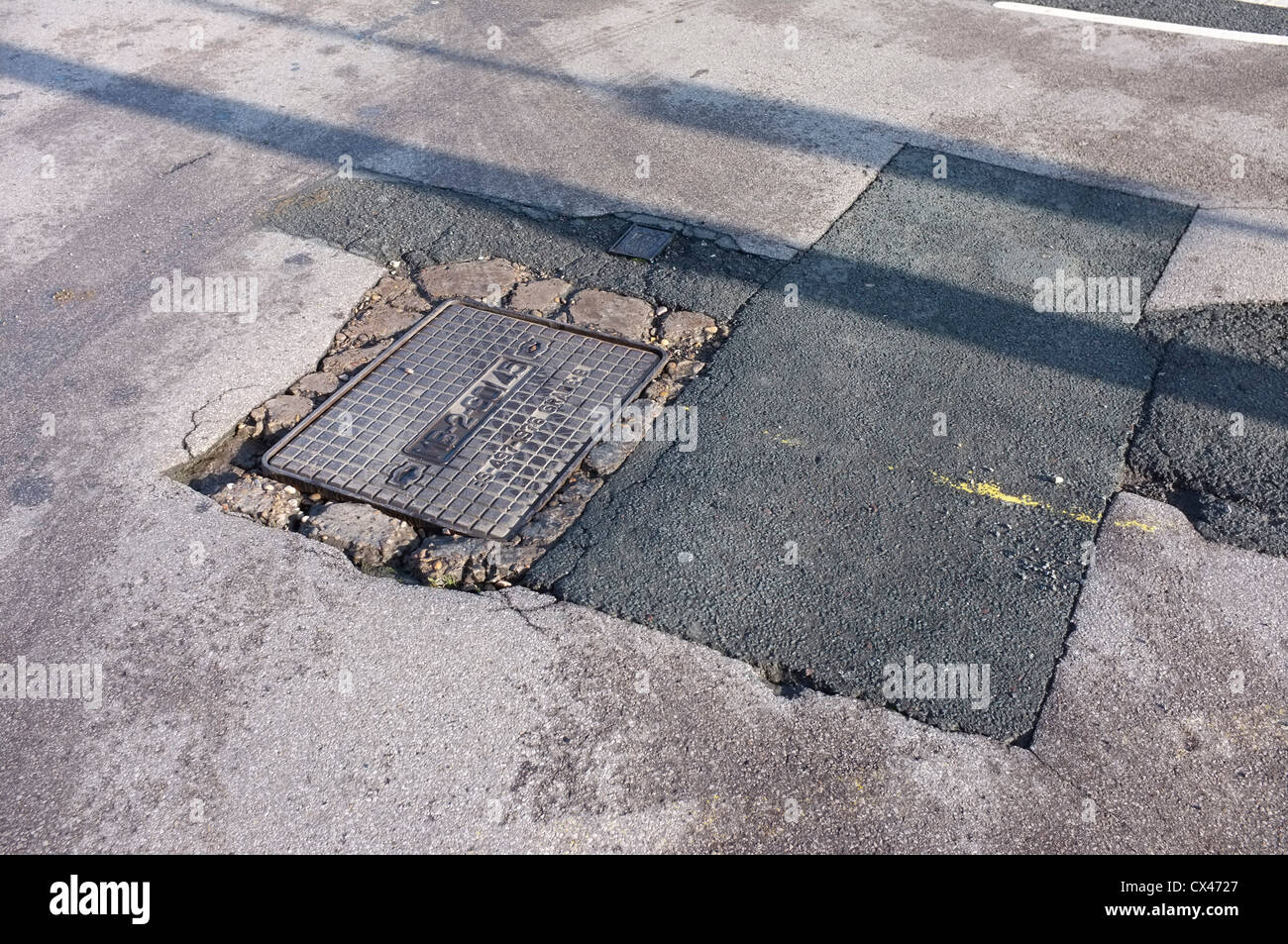 Potholes in roads in Leeds, West Yorkshire, UK Stock Photo - Alamy