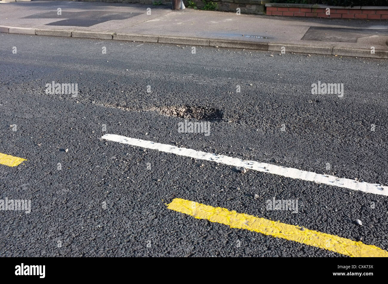 Potholes in roads in Leeds Stock Photo - Alamy