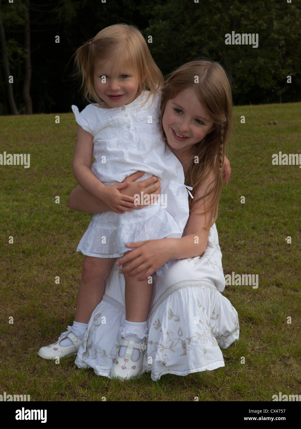 two happy girls - sisters Stock Photo - Alamy