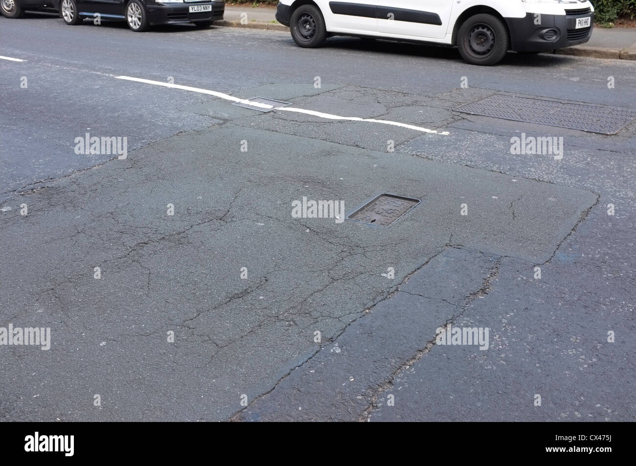 Potholes in roads in Leeds Stock Photo - Alamy