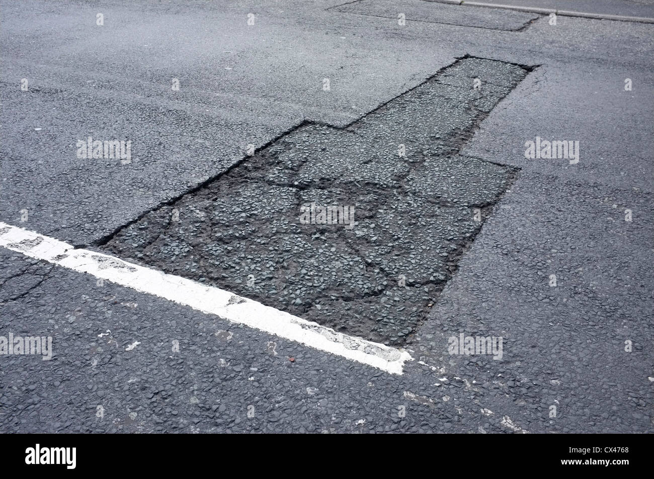 Potholes in roads in Leeds Stock Photo - Alamy