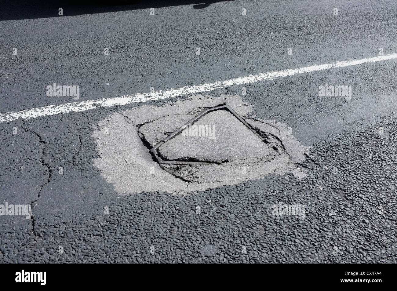 Potholes in roads in Leeds Stock Photo - Alamy