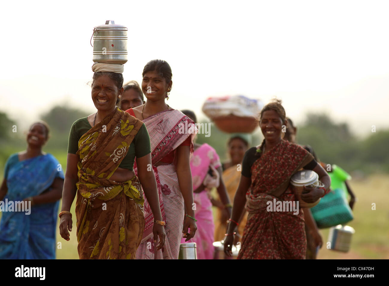 Rural women walking home after a day work in the fields Andhra Pradesh ...