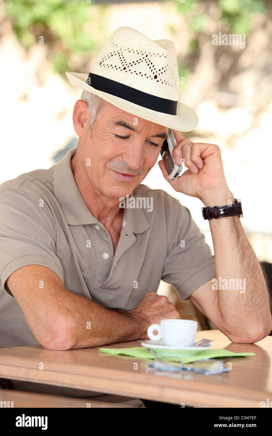 Hat man with phone Stock Photo - Alamy