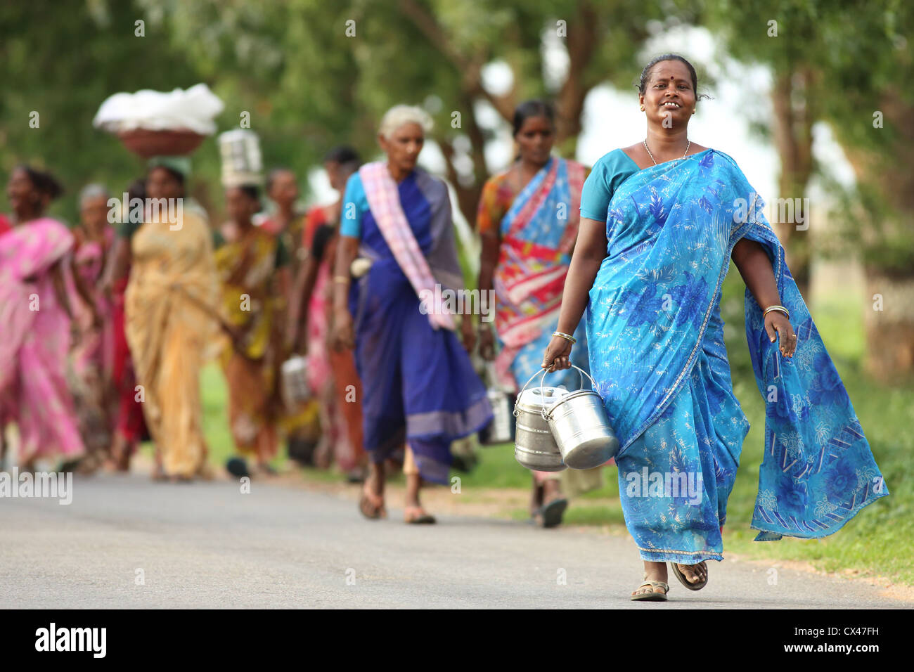 Rural women walking home after a day work in the fields Andhra Pradesh ...