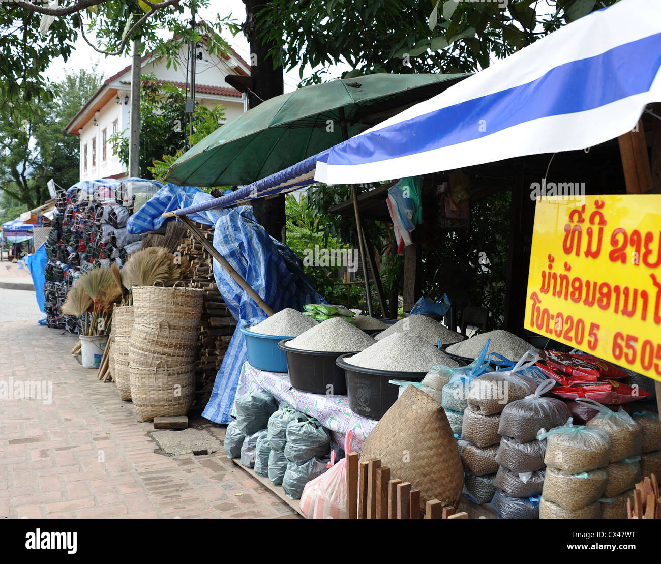 Food and household stalls along the road in Luang Prabang, Laos Stock ...