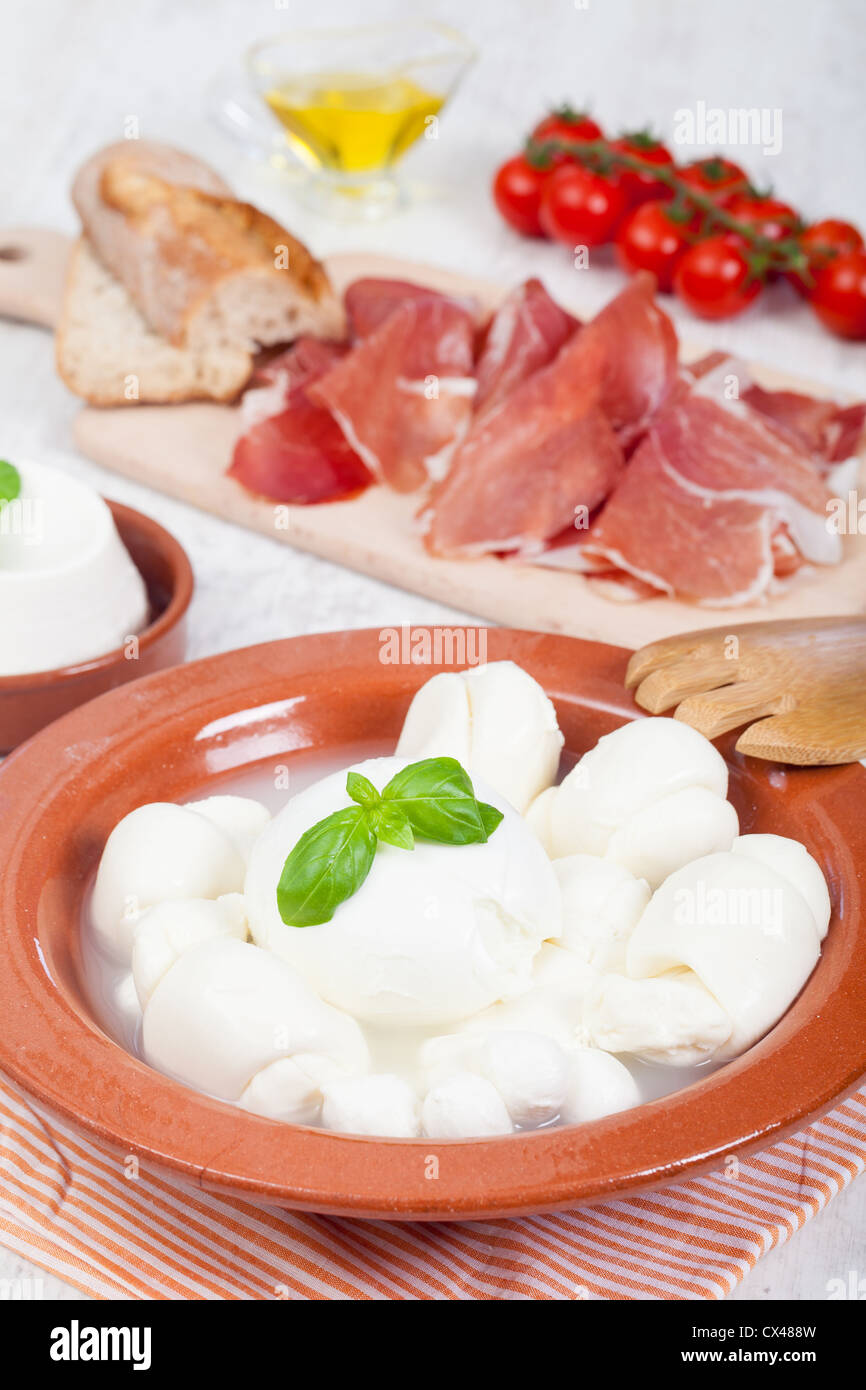 Fresh italian dairy products in earthenware pot Stock Photo - Alamy