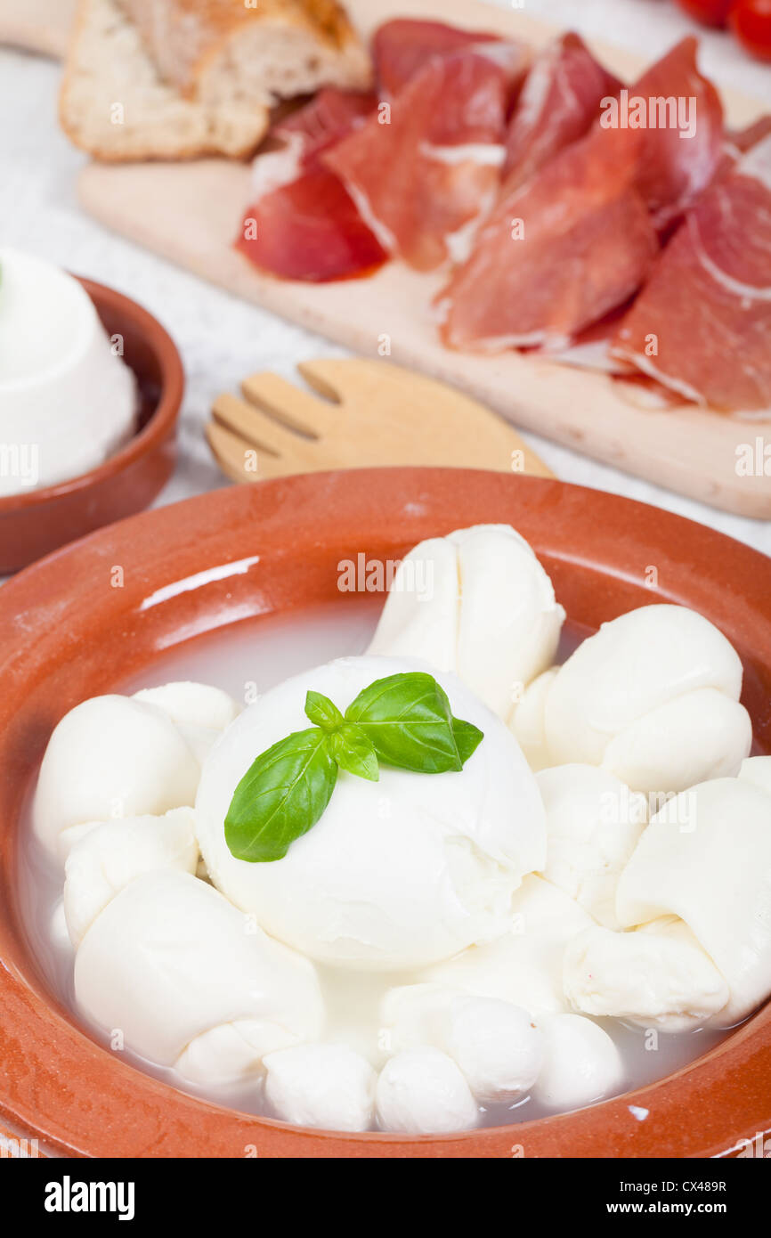 Fresh italian dairy products in earthenware pot Stock Photo - Alamy