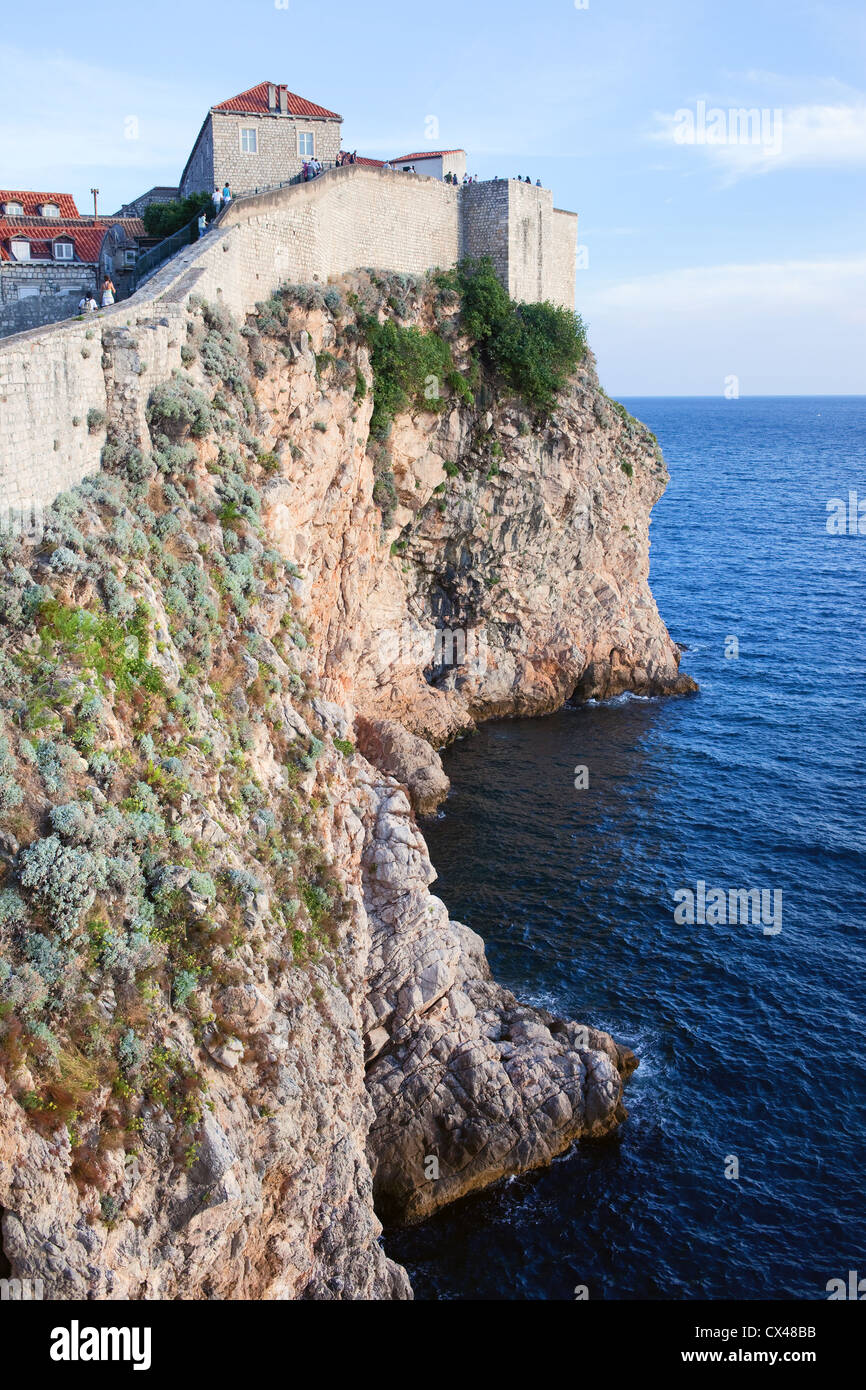High steep cliffs at the Adriatic Sea with fortification of the Old ...