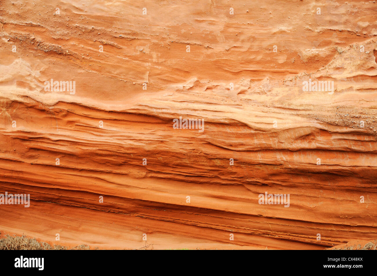 Wind eroded sandstone cliff Stock Photo - Alamy