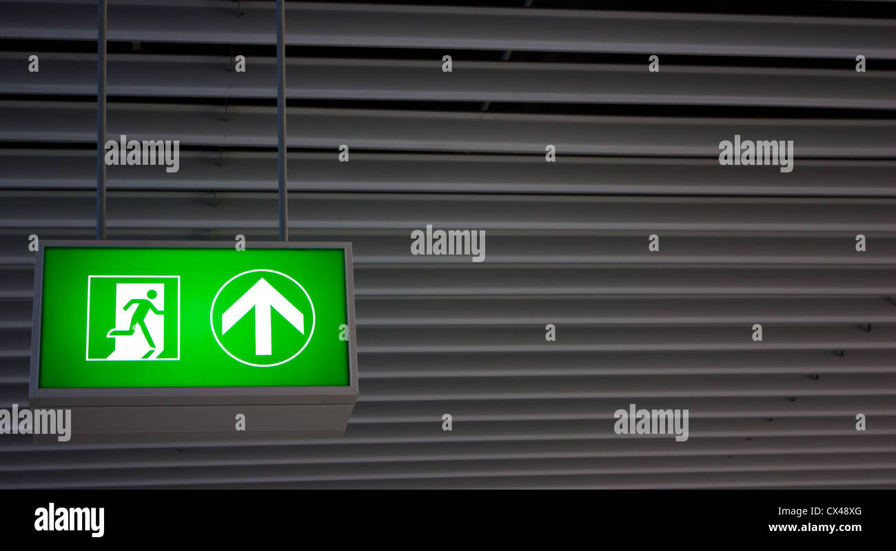 Emergency exit sign in modern offices inside an industrial plant Stock ...