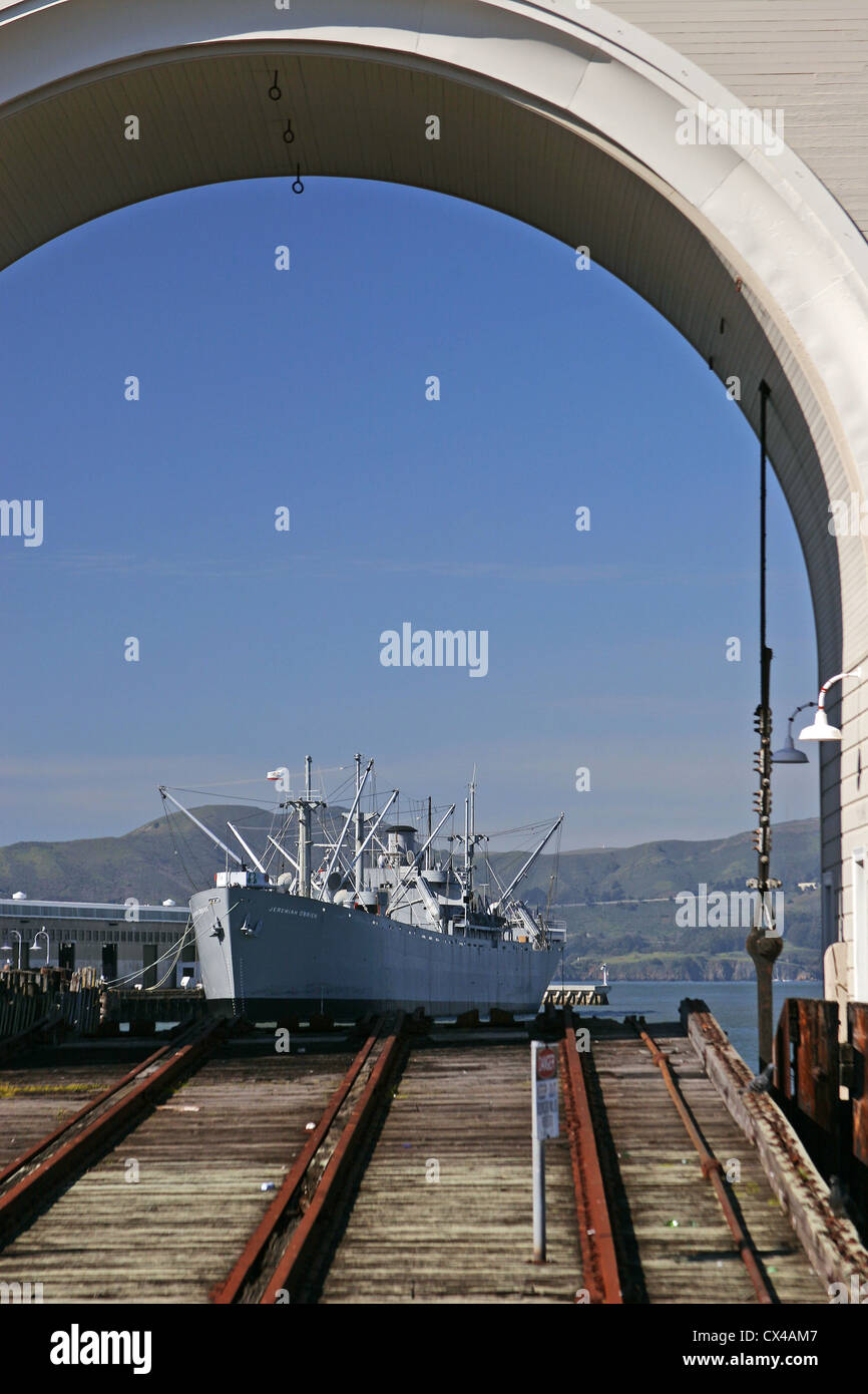 The SS Jeremiah O'Brien, a WW2 Liberty Ship, framed through the arch of ...