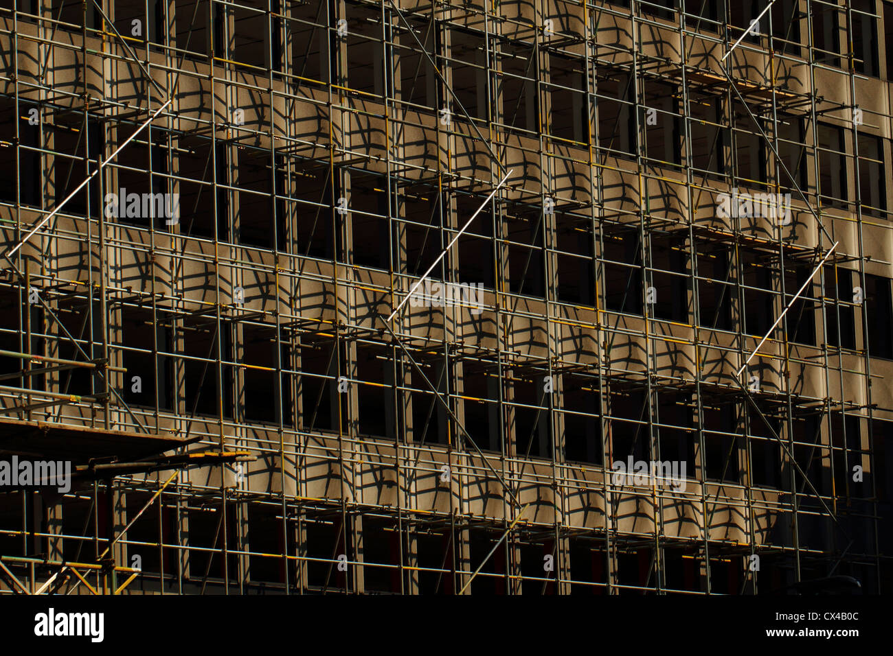 Scaffolding erected against large building Stock Photo - Alamy