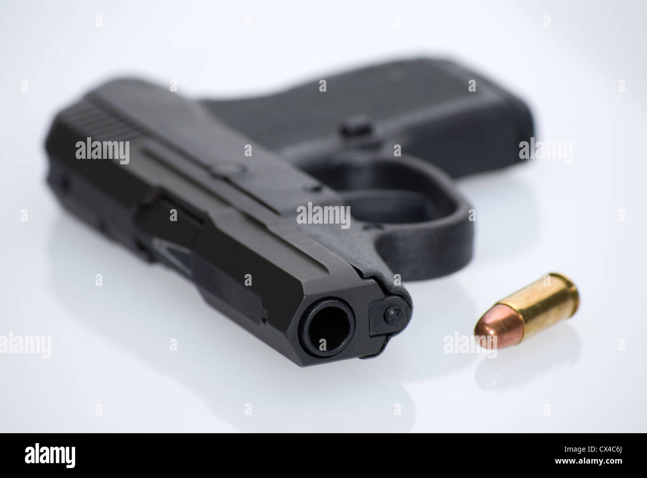 A small pistol and ammunition Stock Photo - Alamy