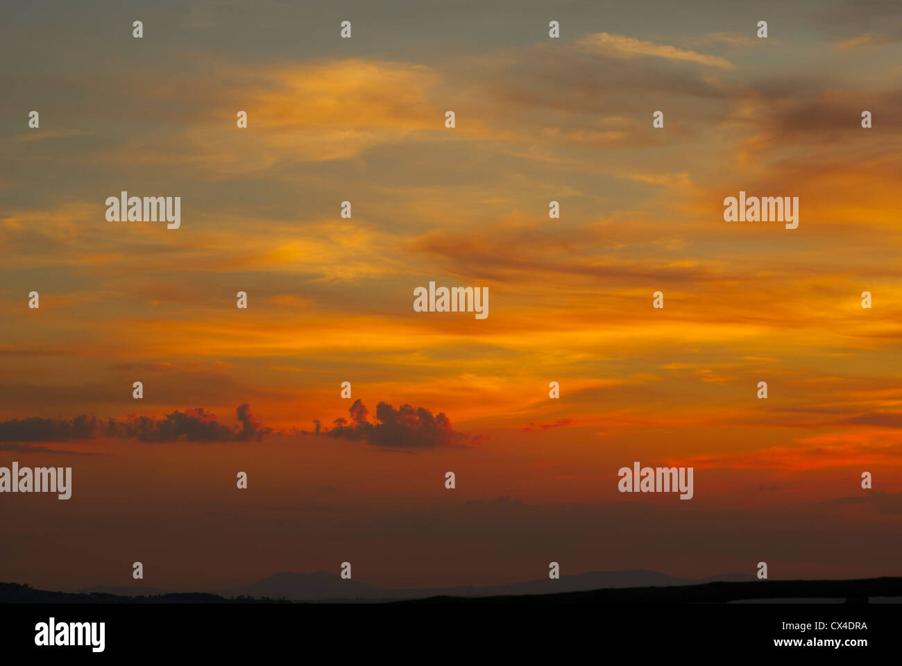 Evening sunset sky With red gold Lighted Clouds Stock Photo - Alamy