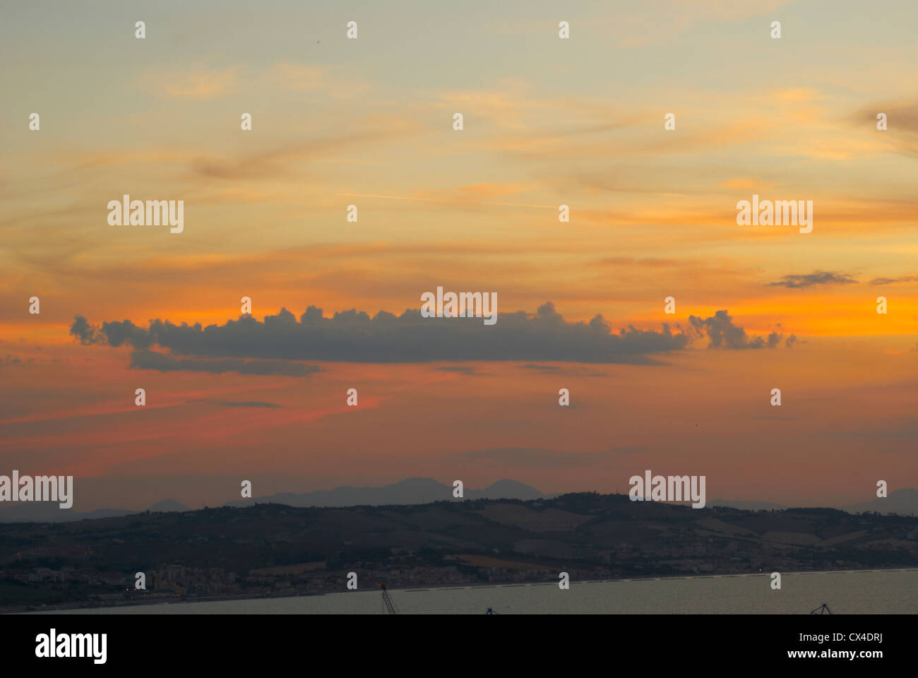 Evening sunset sky With red gold Lighted Clouds Stock Photo - Alamy