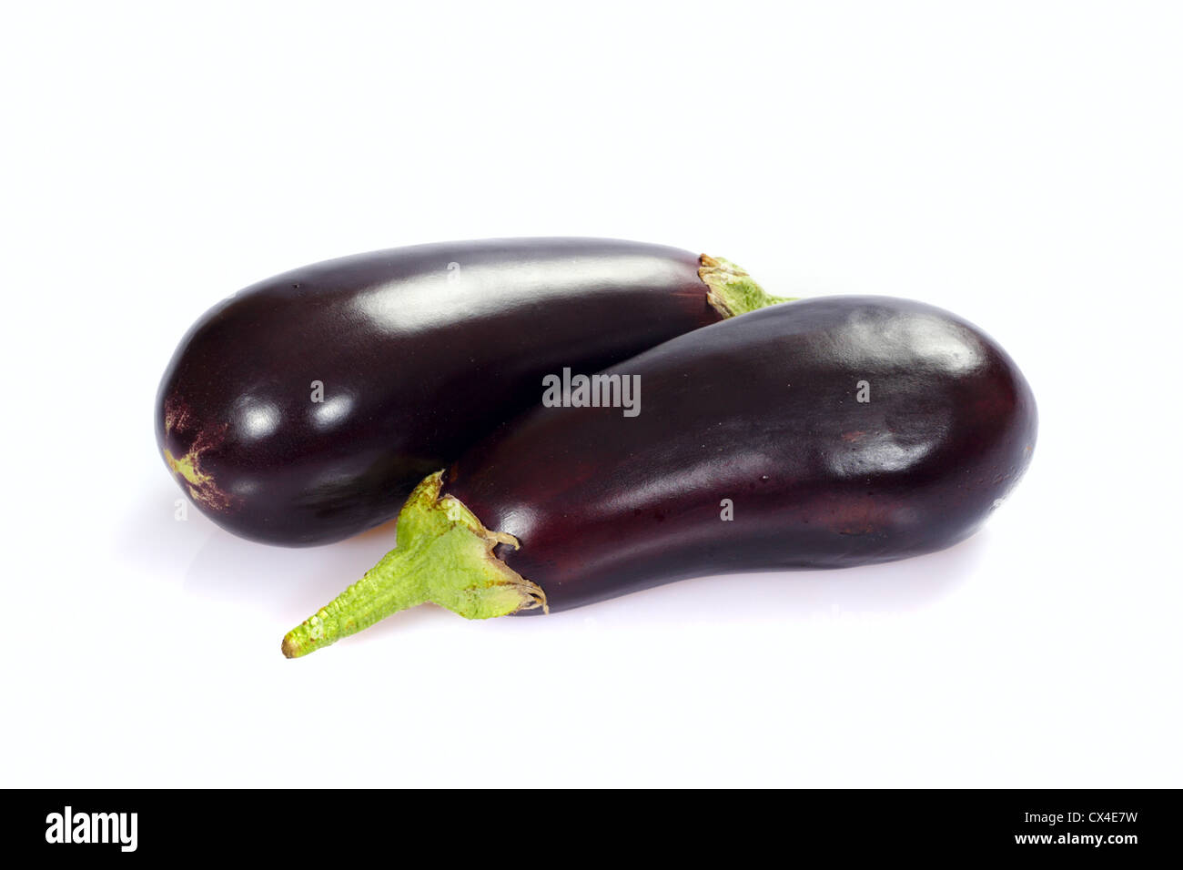 two aubergine, photo on the white background Stock Photo - Alamy