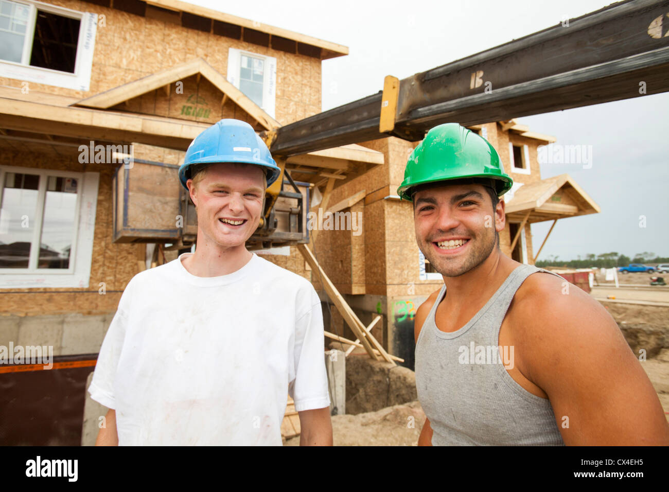 A Construction worker and rows of new houses being built in Fort ...