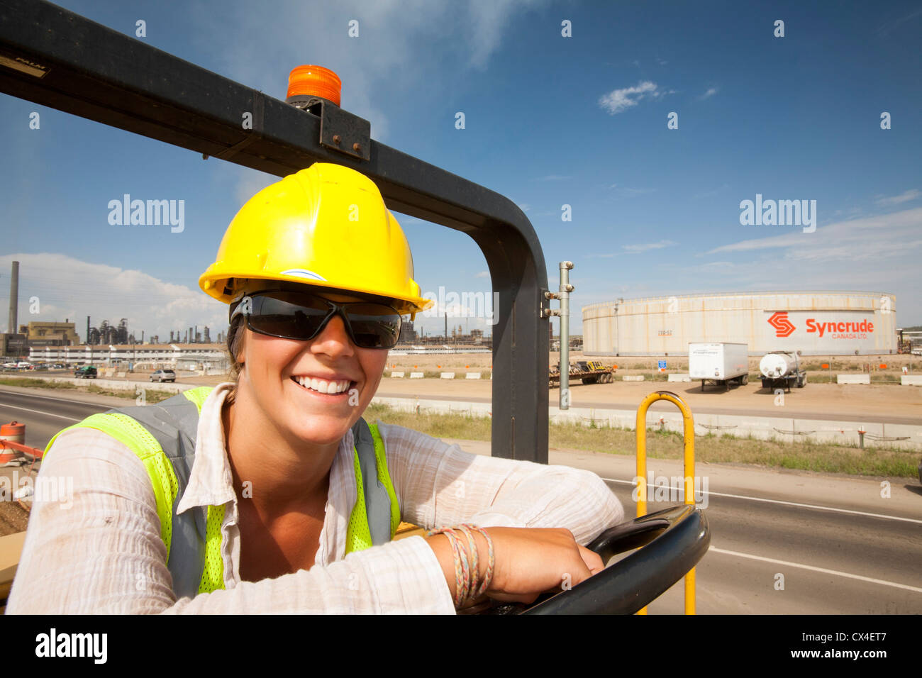 Ali Walker drives a large road rolling machine at the Syncrude Mildred ...