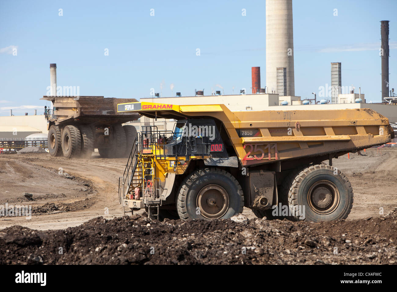 Massive dump trucks by the Syncrude upgrader plant. The tar sands are ...